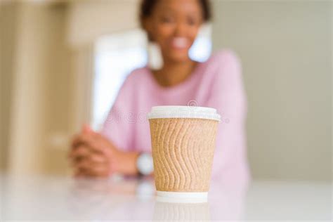 Beautiful Youn Woman With Afro Hair Drinking A Coffee In A Take Away