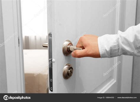 man opening door