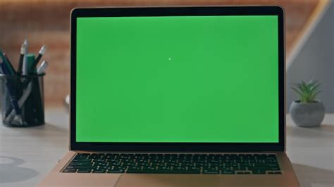 Premium Photo Modern Green Screen Laptop Placed On Empty Office Table Closeup Mockup Computer