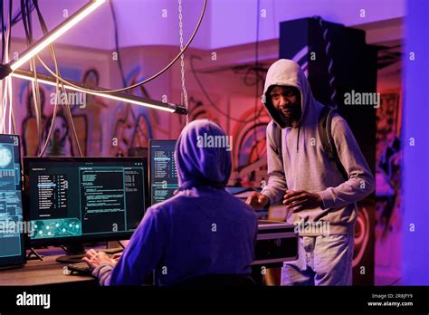 african american hacker bringing black box with technology for