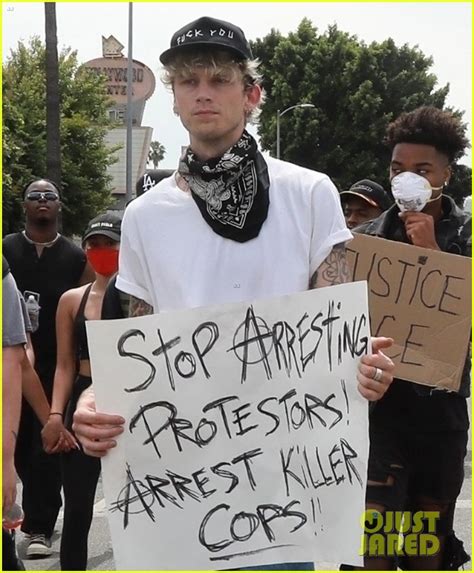 Machine Gun Kelly Carries Arrest Killer Cops Sign While Protesting