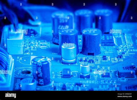 Power Capacitors And Chips In Blue Color On A Microcircuit Board Stock Photo Alamy