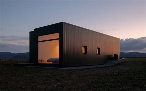 Dualchas Architects Creates Minimalist Blackened Oak Hideaway On