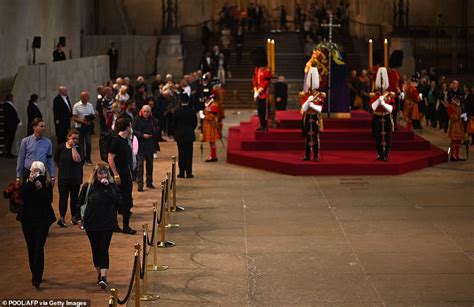 Drama Ensues After Guard Faints At Podium Beside Queens Coffin Daily