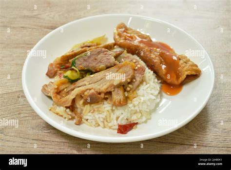 Spicy Stir Fried Barbecue Pork Neck With Chili And Basil Leaf Topping