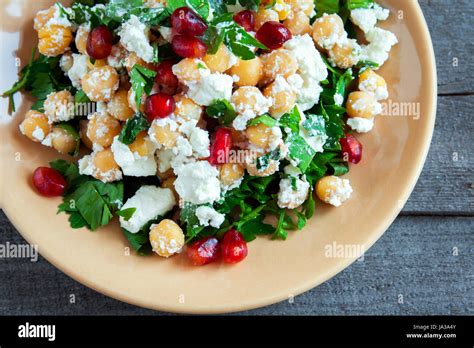 Chickpea Salad With Fresh Feta Cheese Parsley And Pomegranate Seeds