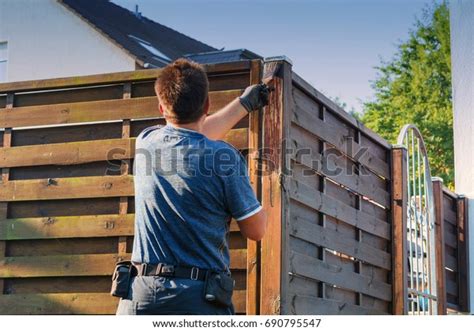 Man Building A Fence Over Royalty Free Licensable Stock Photos Shutterstock