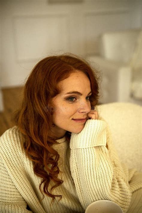 A Woman Sitting On A Bed Stock Image Image Of Decorating 354417481