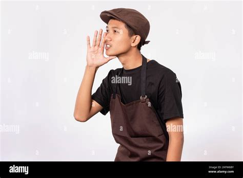 Handsome Barista Asian Man Wearing Brown Apron And Black T Shirt