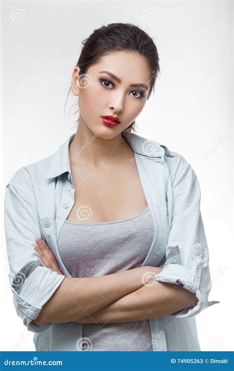 Annoyed Asian Woman With Arms Crossed On White Background Stock Image