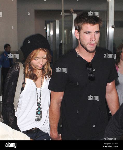 Miley Cyrus And Liam Hemsworth Miley Cyrus Arrives At Lax Airport On A