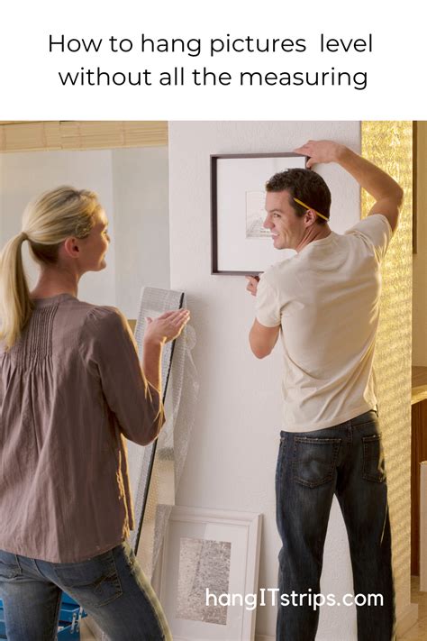 How To Hang Pictures Level Without All The Measuring Hanging Pictures Picture Hanging Tips