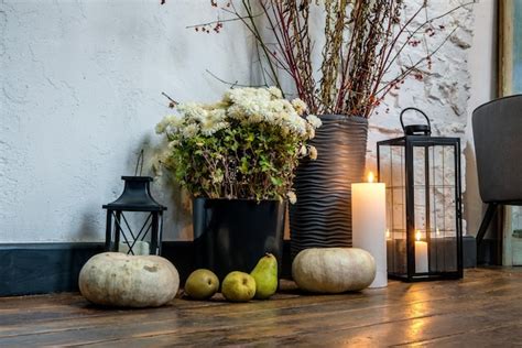 Premium Photo Burning Candles On A Table With Flowers With Glasses Or