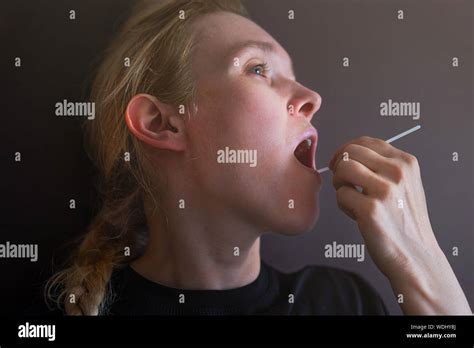 Woman Doing Dna Test With Cotton Swab At Home Test For Home Use Stock
