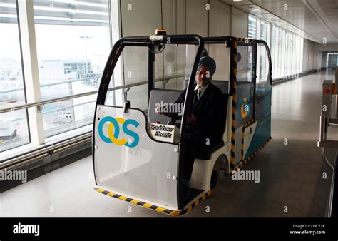 General Stock Ocs Buggy Terminal Heathrow Airport Stock Photo