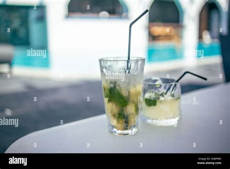 Mojito Cocktail At The Edge Of A Resort Pool Concept Of Luxury