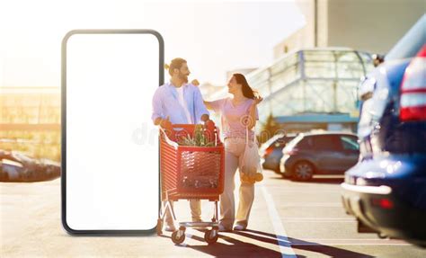 Couple Shopping Together At A Grocery Store On A Sunny Afternoon Stock