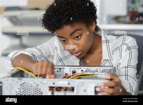 Photo Of Woman Fixing A Broken Processor Stock Photo Alamy