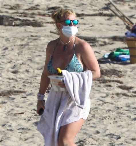 Britney Spears Sunbathing On The Beach In Malibu With Her Security