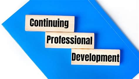 Premium Photo There Is A Blue Notebook On A Light Gray Background Above Are Three Wooden