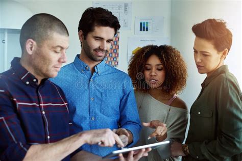 Common Purpose Is The Driving Force Of Teams A Group Of Coworkers Discussing Something On A