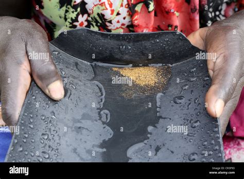 Woman Panning Gold In The Polluted Jaba River Flowing From Panguna