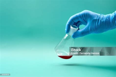 Unrecognizable Scientist Holding Titration Flask In Laboratory Stock