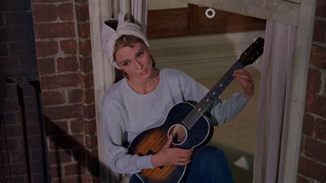 Download Breakfast At Tiffanys With Guitar Wallpaper