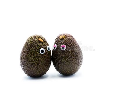 Pares Rom Nticos De Los Aguacates Con Los Ojos Googly Imagen De Archivo