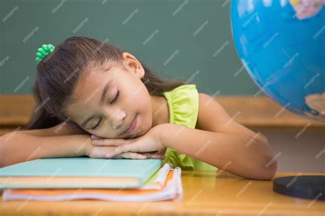 Premium Photo Cute Pupil Napping In Classroom With Globe