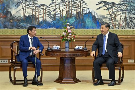 Xi Turns To Former Philippine Leader As Marcos Embraces Us Bloomberg