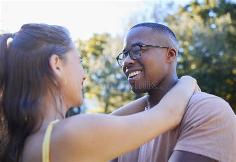 Interracial Couple Smile And Hug For Love Care Or Embracing