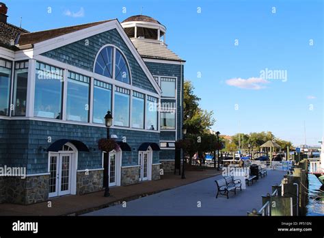 A Historic Building And Boardwalk Along The Potomac River Waterfront