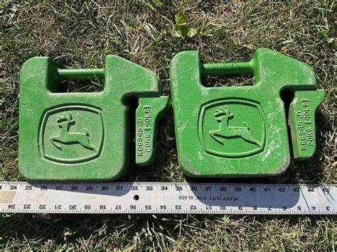 Two John Deere Weights Legacy Auction Company