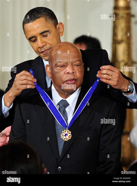 United States President Barack Obama And First Lady Michelle Obama Present The Medal Of