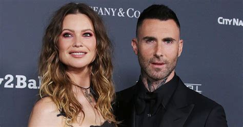 Adam Levine Isnt Letting Cheating Scandal Get To Him Us Weekly