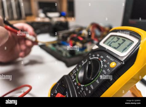Detail Of A Multimeter Being Used By A Technical IT On A Computer Motherboard Stock Photo Alamy