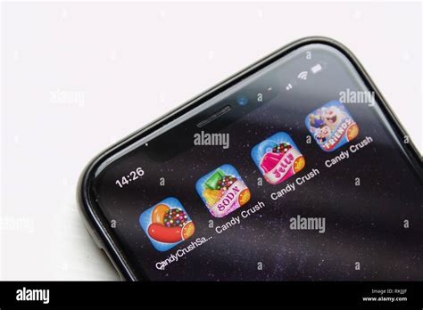 Four Candy Crush Saga Games On An Iphone X Against A White Background All Four Candy Games Are