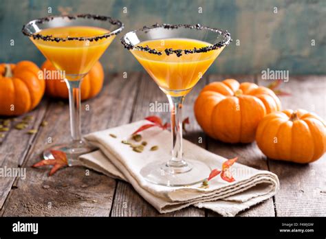 Pumpkintini Pumpkin Martini Coctail With Black Salt Rim For Fall And Halloween Parties Stock