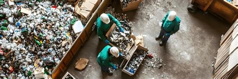Premium Photo Recycling Facility With Workers Sorting Materials