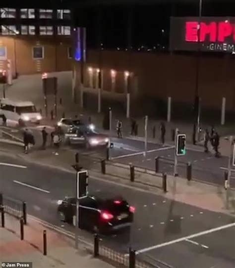 Moment Massive Brawl Erupts At Traffic Lights As Two Gangs Kick And