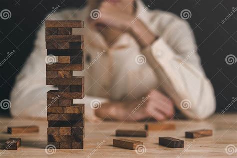 A Wooden Jenga Box Placed On The Tablefinancial Risk Management And Strategic Planning Through