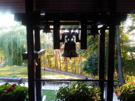 Church Bells On A Romanian Monastery S Porch In The Sunlight Stock