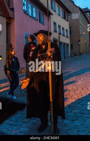Vertical Shot Of The Night Watchman Tour In Rothenburg Germany Stock
