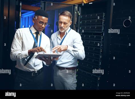 doing their daily inspections two technicians using a digital tablet