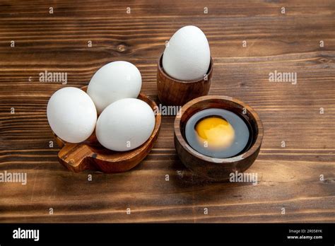 Front View Raw Eggs Whole Products On Brown Wooden Background Egg Food