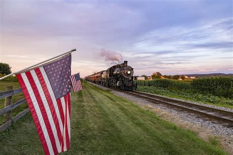 A View Of A Classic Steam Passenger Train Approaching With American