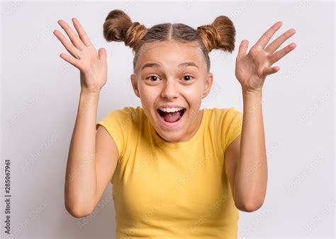 Portrait Of Joyful Or Surprised Teen Girl With Raised Hands Beautiful