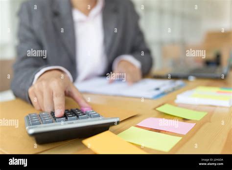 Businesswoman Using A Calculator To Calculate The Numbers Accounting Accountancy Calculation