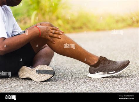 Runner Black Man Wear Watch Sitting He Uses Hands Joint Hold On His